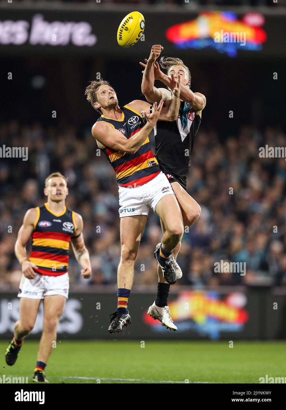 Rory Sloane of the Crows clashes with Miles Bergman of the Power during ...