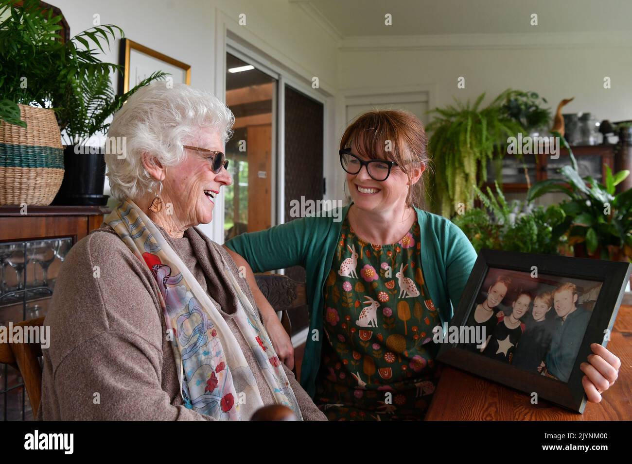 Fiona Walmsley with her mother Gay looks at a family portrait of Gay’s ...