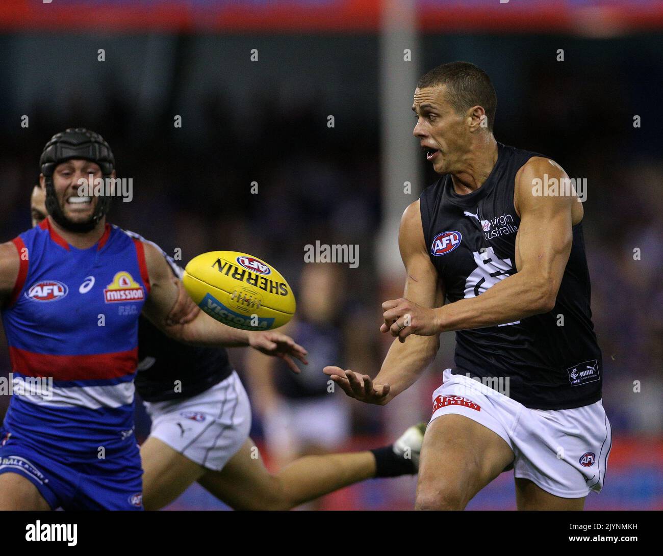 Ed Curnow of the Blues handpasses during the Round 8 AFL match between ...