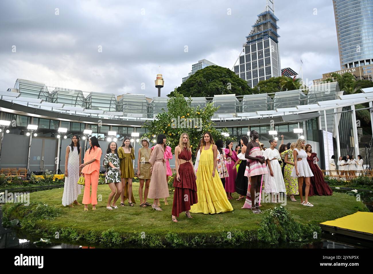 Models pose for a group photo following during the Aje Resort 22 runway ...