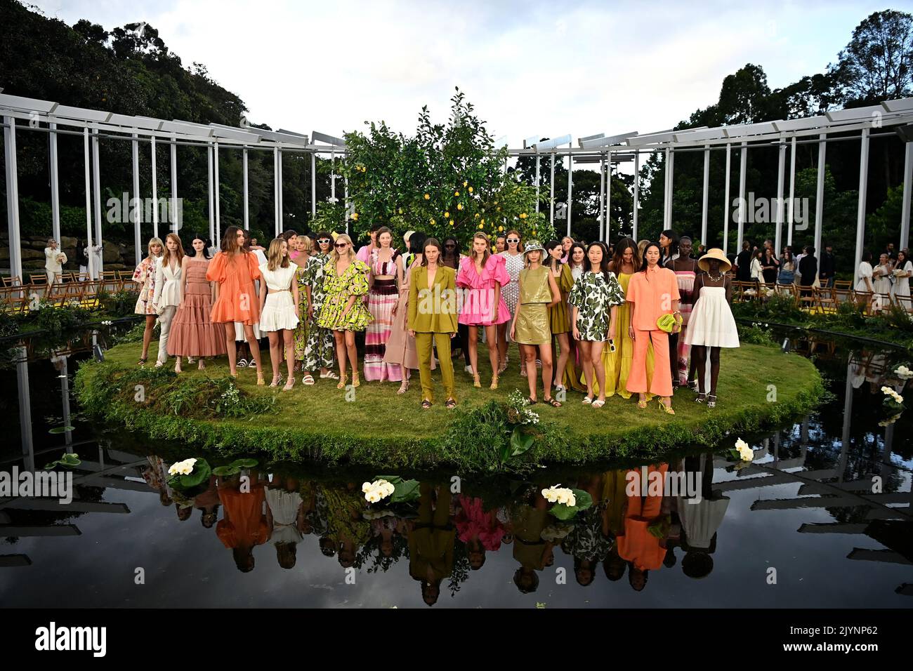 Models pose for a group photo following during the Aje Resort 22 runway ...