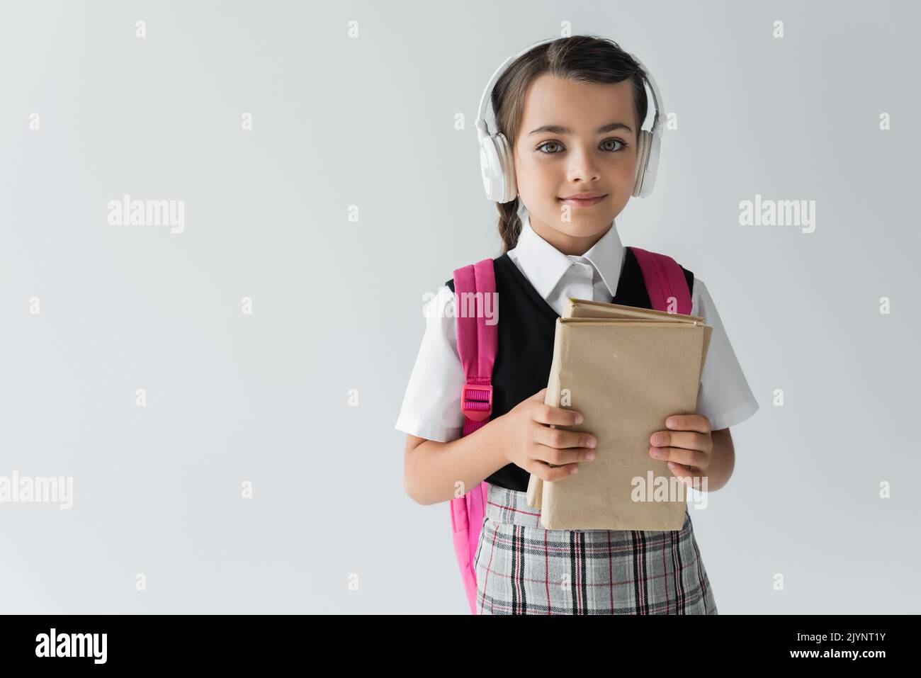 School girl in uniform grey skirt hi-res stock photography and images ...