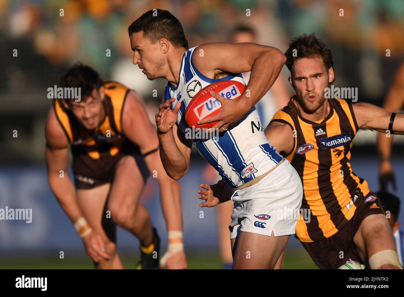 Luke Davies-Uniacke of North Melbourne (centre) in action during the ...