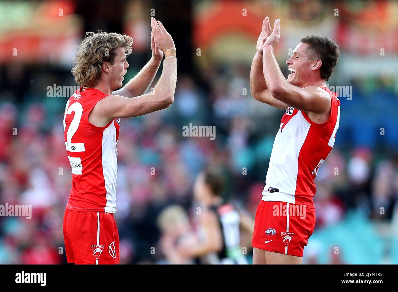 Nick Blakey of the Swans celebrates kicking a goal with team mate ...