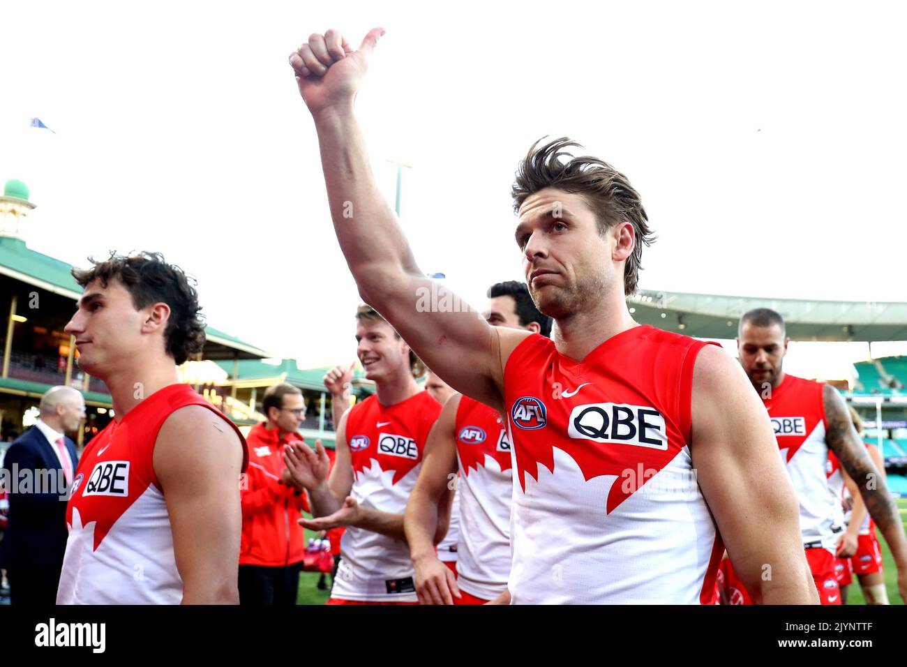 Dane Rampe of the Swans celebrates with team mates as the Swans players ...