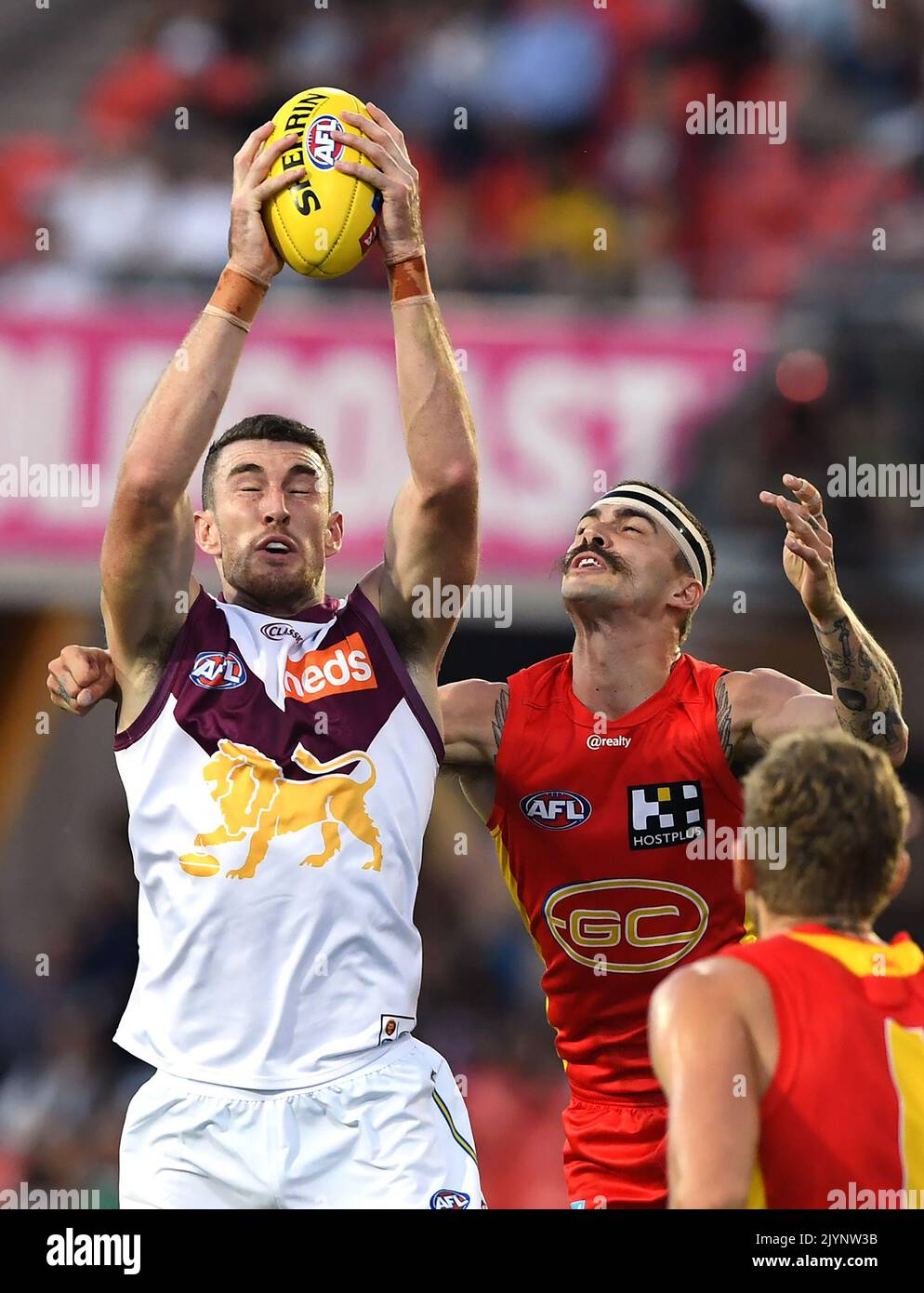 Daniel McStay of the Lions marks ahead of Oleg Markov of the Suns ...