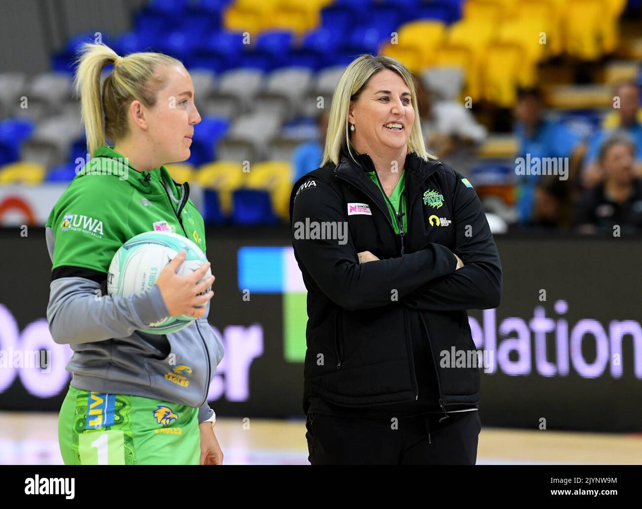 West Coast Fever coach Stacey Marinkovich (right) chats to player ...