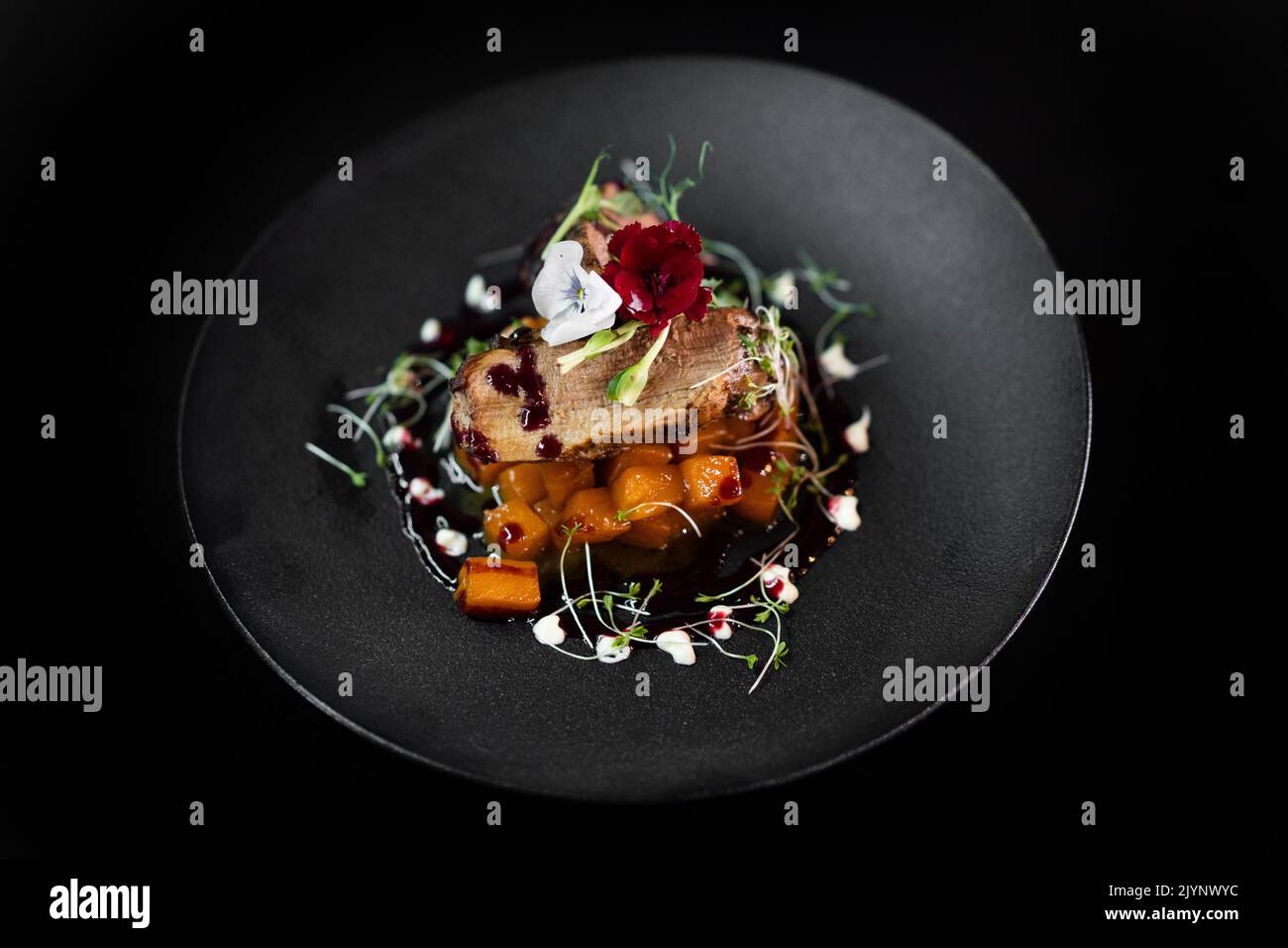 close up of an exquisite serving of a special dish from the chef on a ...