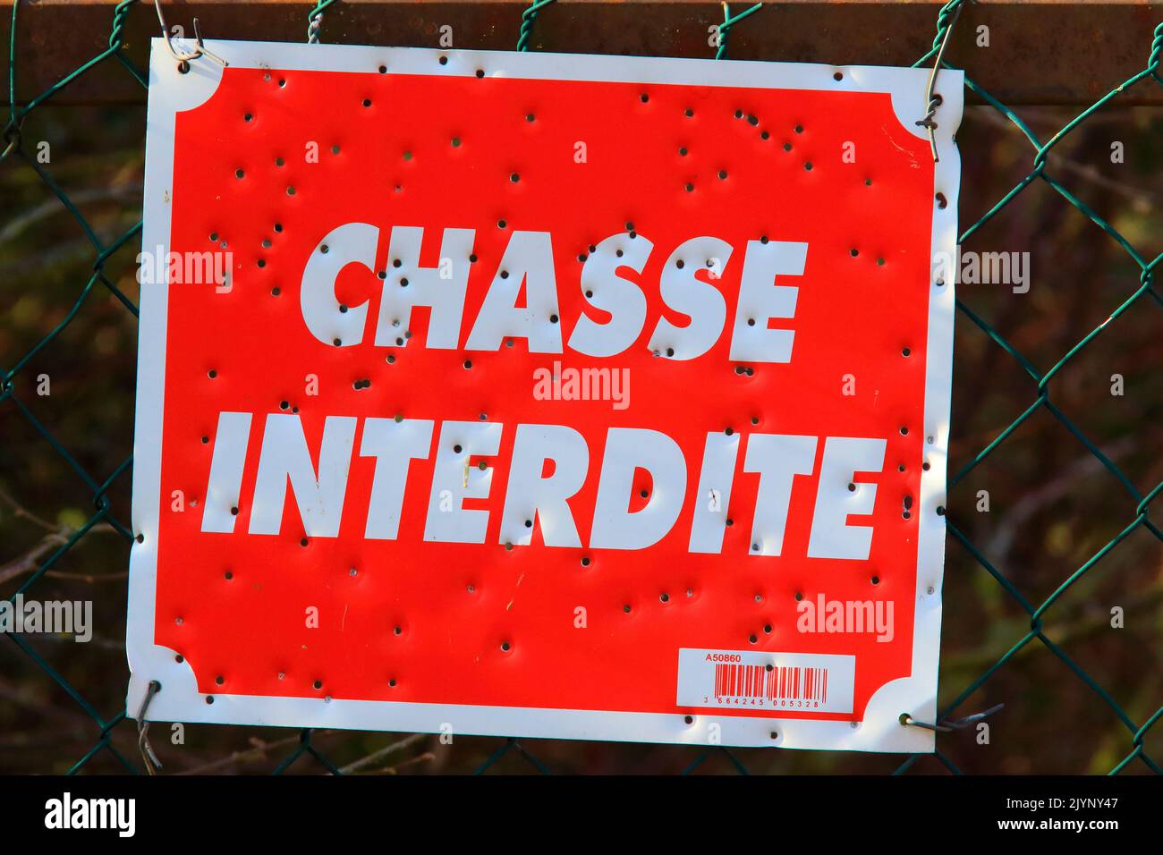 "No hunting" sign shot by hunters' shots, France Stock Photo - Alamy