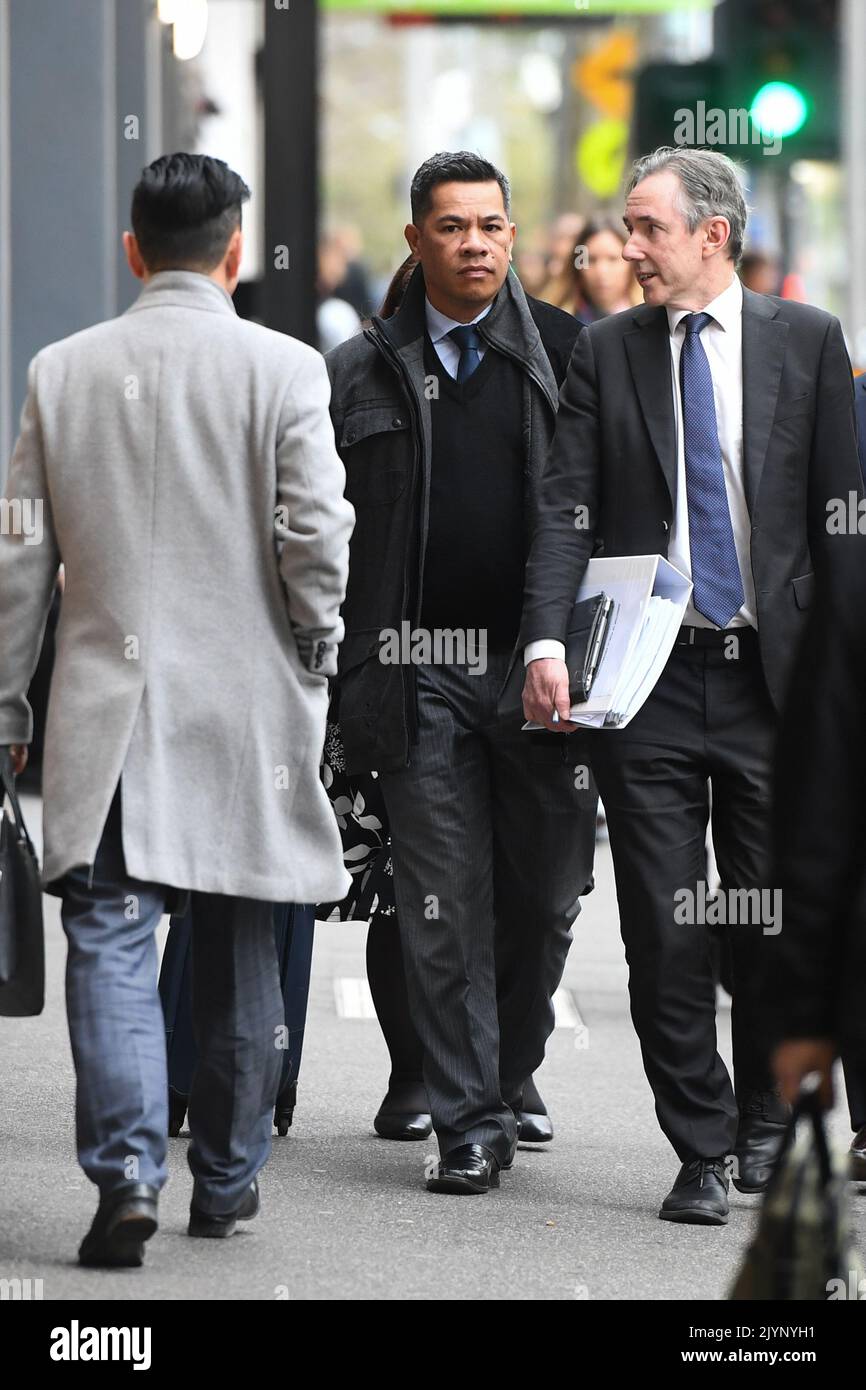 Simiona Tuteru (centre) arrives at the Melbourne Magistrates Court in ...