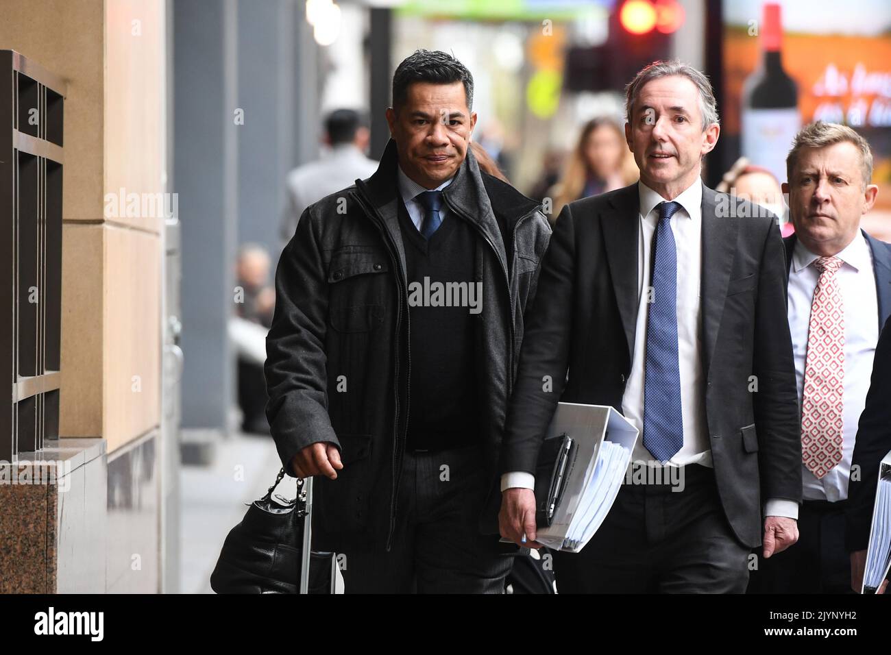 Simiona Tuteru (left) arrives at the Melbourne Magistrates Court in ...