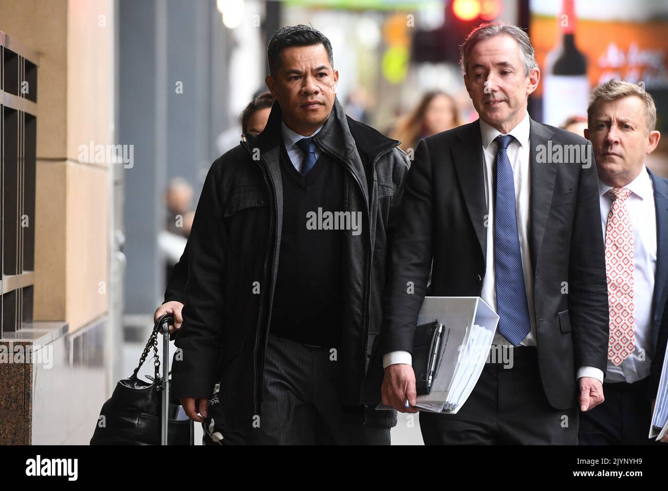 Simiona Tuteru (left) arrives at the Melbourne Magistrates Court in ...
