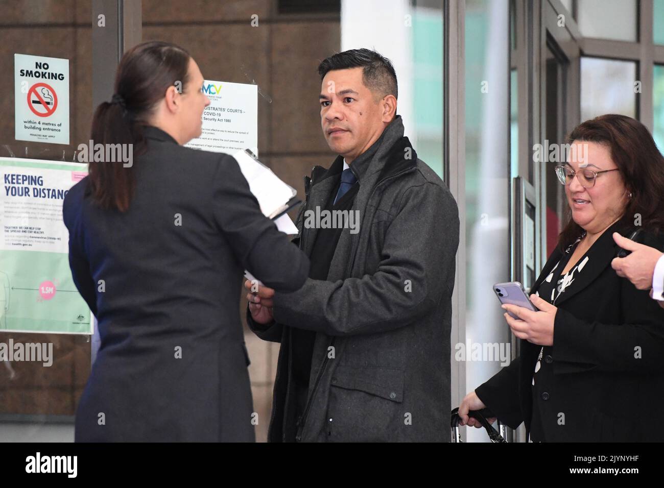Simiona Tuteru (centre) arrives at the Melbourne Magistrates Court in ...