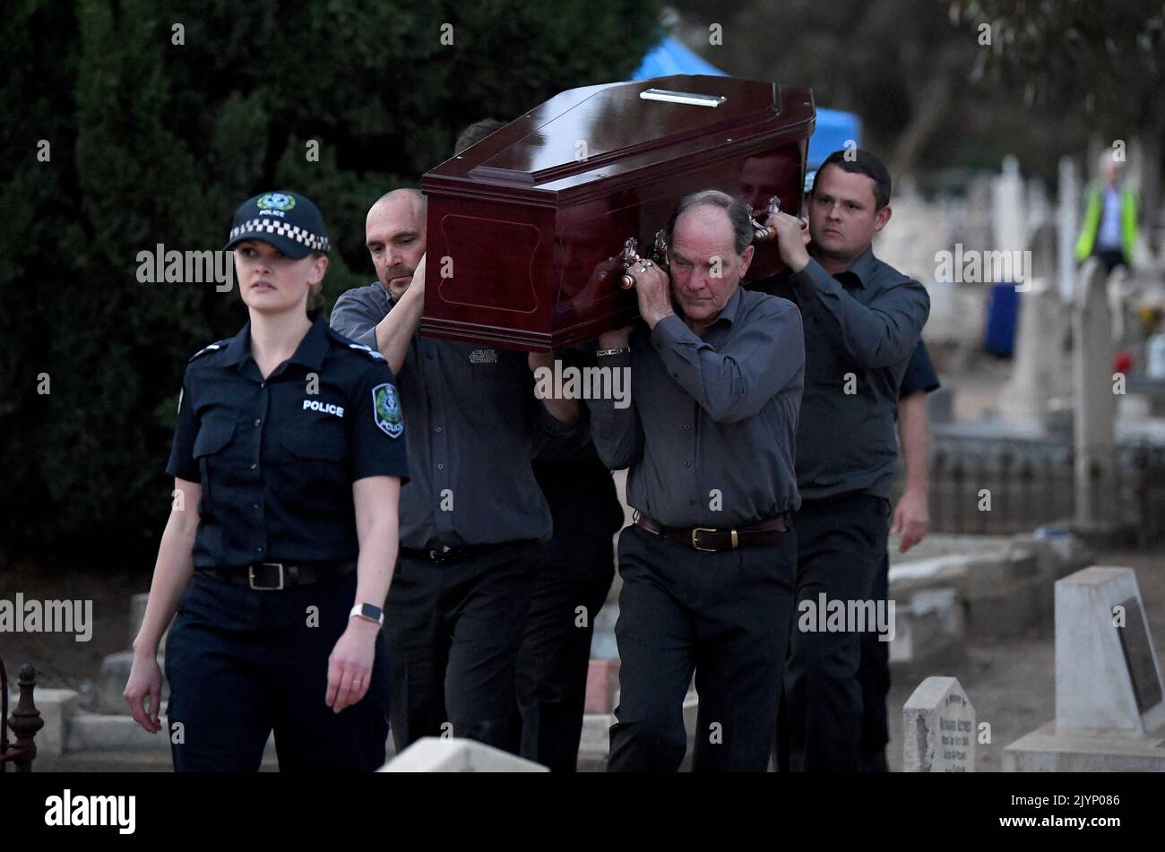 Adelaide Cemetery Authority pall bearers carry the body of the exhumed ...