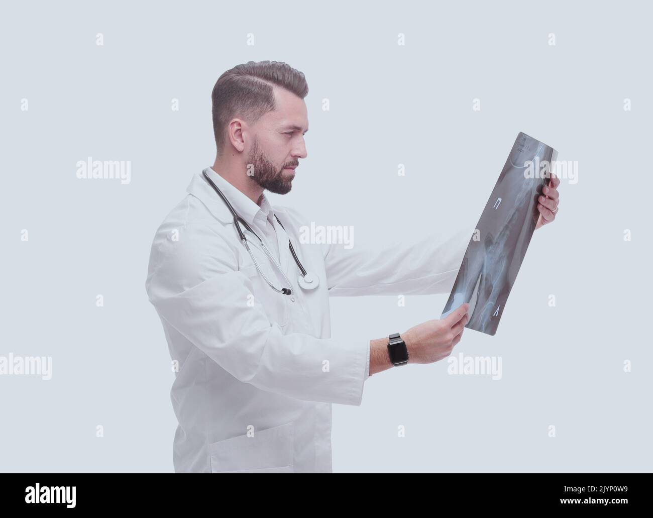 in full growth. medical doctor looking closely at the x-ray Stock Photo ...