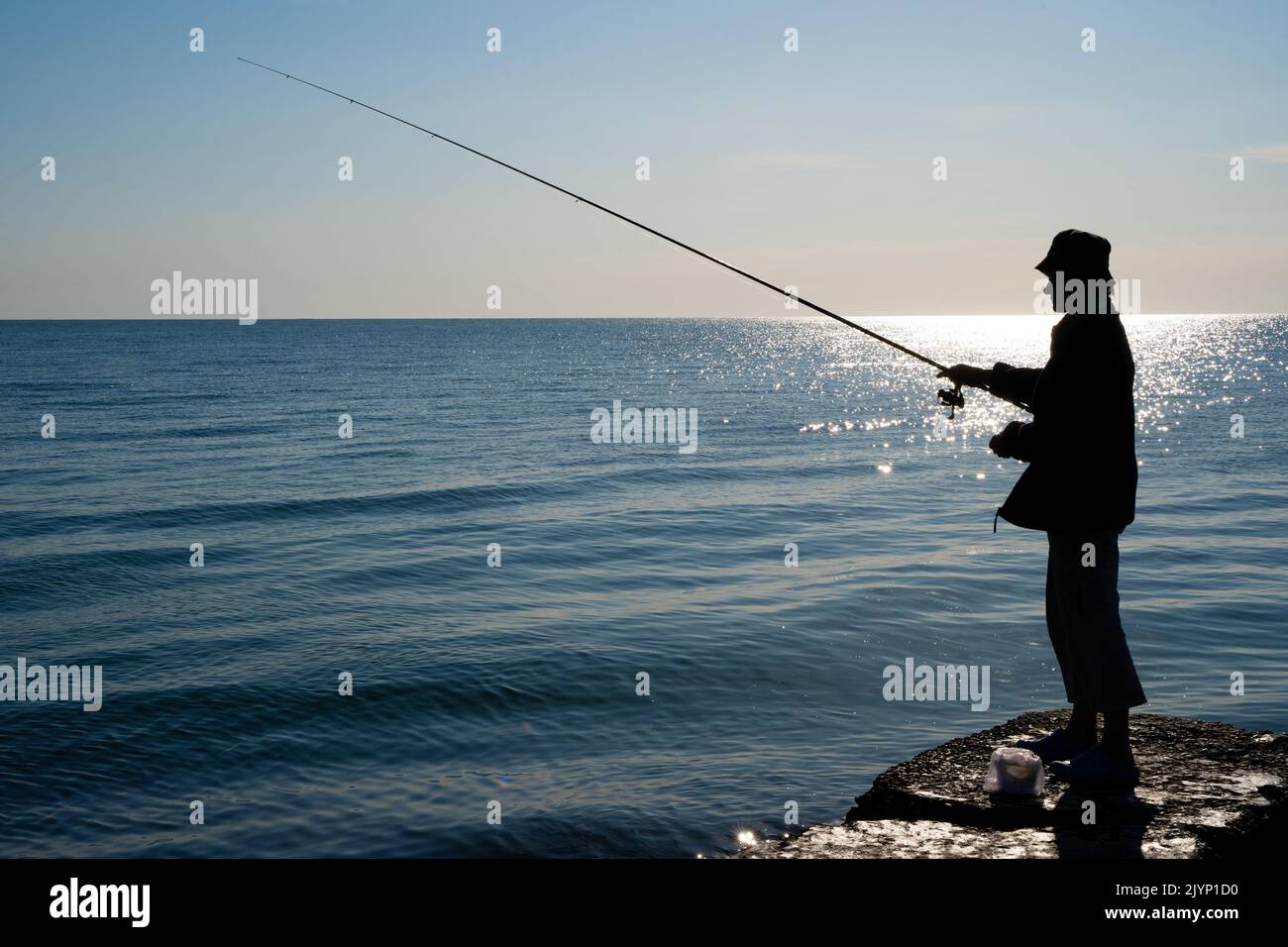 Male fisherman catches fish on hi-res stock photography and images - Alamy
