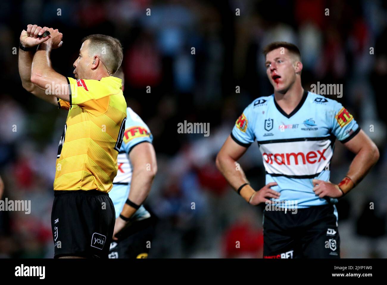 Referee Ben Cummins places Teig Wilton of the Sharks on report during ...