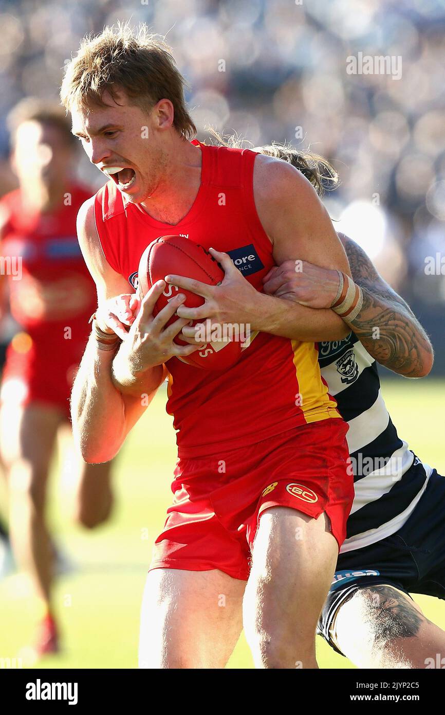 Noah Anderson of the Suns is tackled during the Round 10 AFL match ...