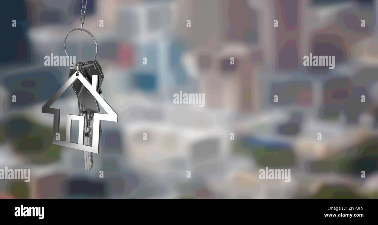 Image of silver house key fob and key, hanging in front of blurred ...