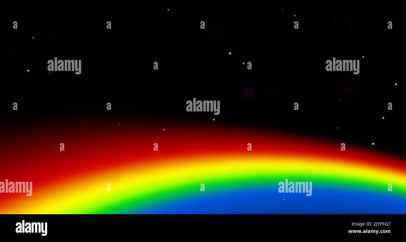 Image of rainbow and colourful light trail moving on black background ...