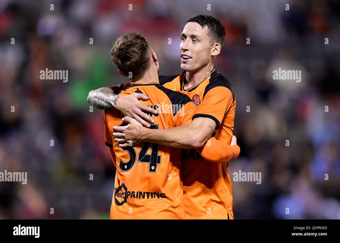 Alex Parsons (left) of the Roar celebrates scoring a goal with Scott ...