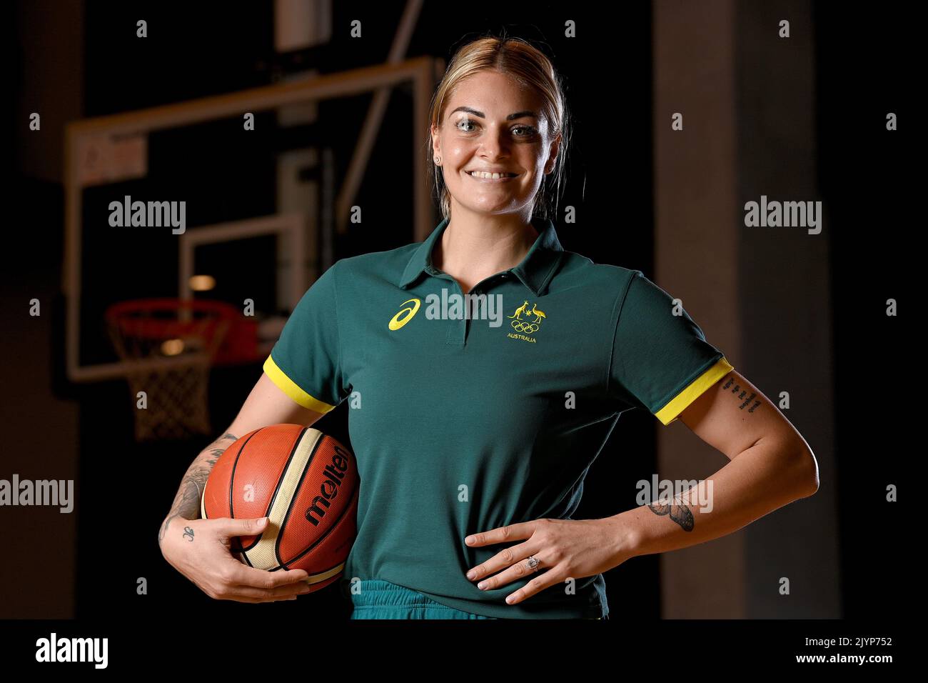 Basketballer Cayla George poses for a photograph during an announcement ...