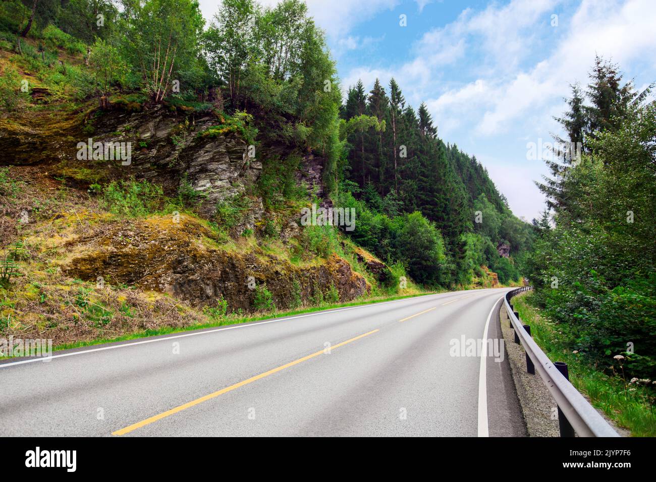 beautiful paved road through the mountains and forests Stock Photo - Alamy