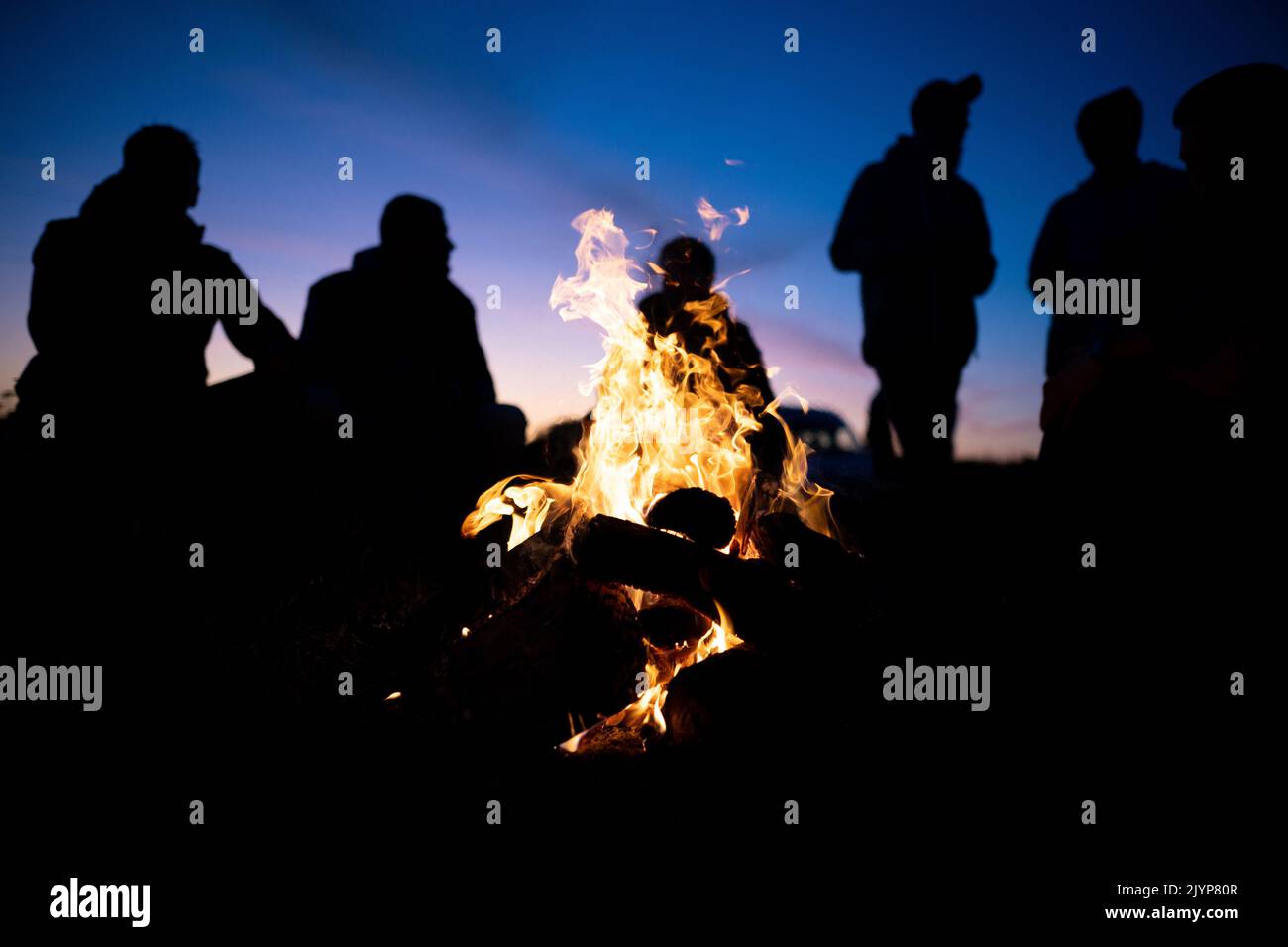 Silhouette people around bonfire hi-res stock photography and images ...
