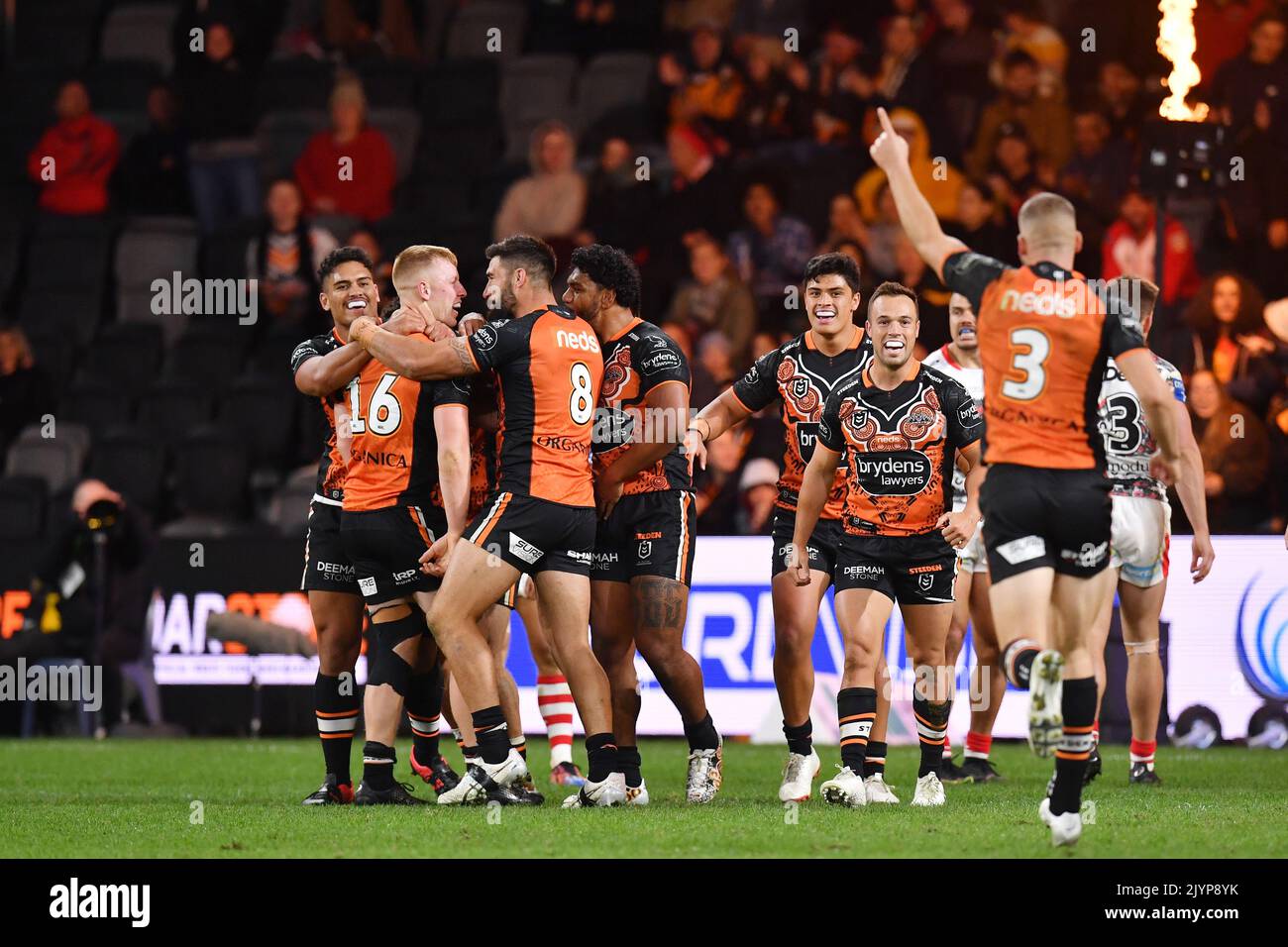 The Tigers celebrate Alex Seyfarth’s try during the Round 12 NRL match ...