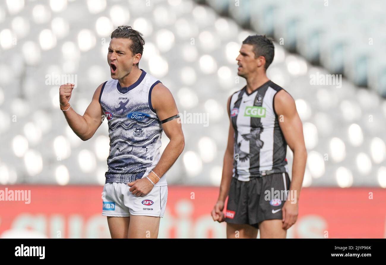 Luke Dahlhaus of the Cats celebrates after kicking a goal as Scott ...