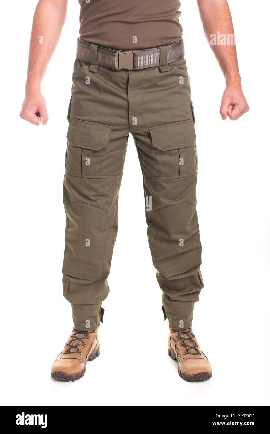 A fighter in military uniform is ready for a fight on a white ...