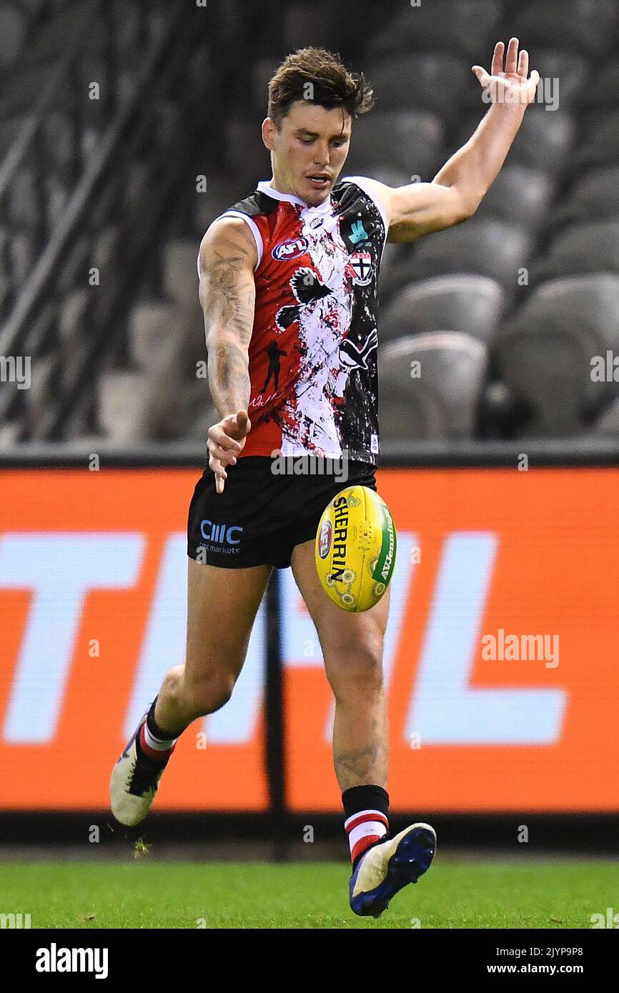 Josh Battle of St Kilda kicks the footy during the Round 11 AFL match ...