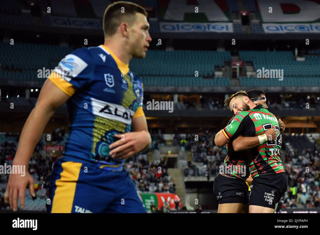 Alex Johnston of the Rabbitohs celebrates scoring a try with teammate ...
