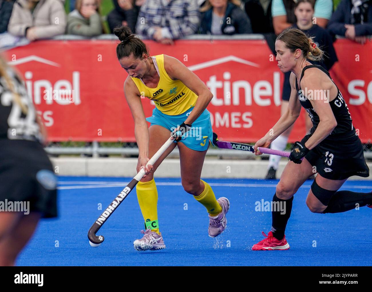 Brooke Peris of the Hockeyroos and Samantha Charlton of the Black Sticks in action during the ...