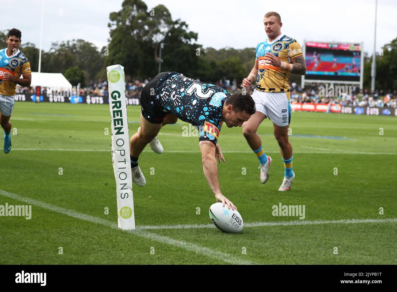 Connor Tracey of the Sharks scores a try during the Round 12 NRL match ...