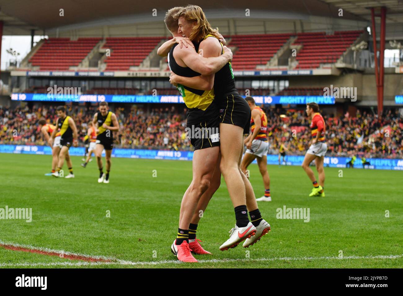 Hugo Ralphsmith of the Tigers celebrates his goal with Jack Riewoldt of ...