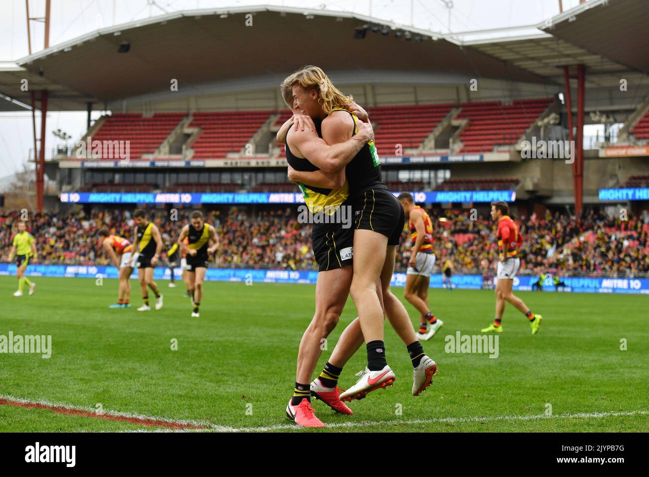 Hugo Ralphsmith of the Tigers celebrates his goal with Jack Riewoldt of ...