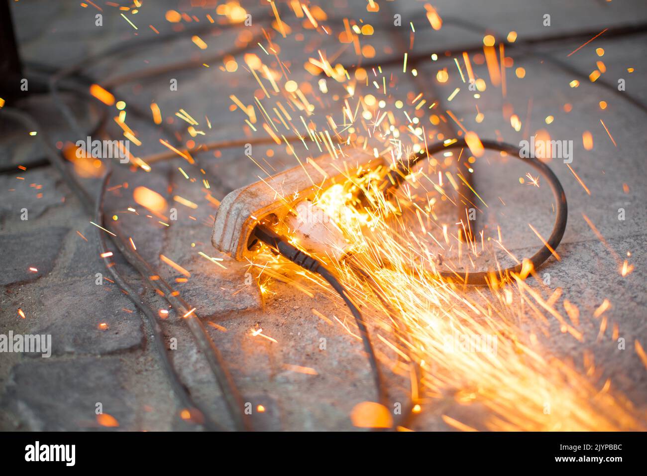 burning spark electrical outlet shorting, danger Stock Photo - Alamy