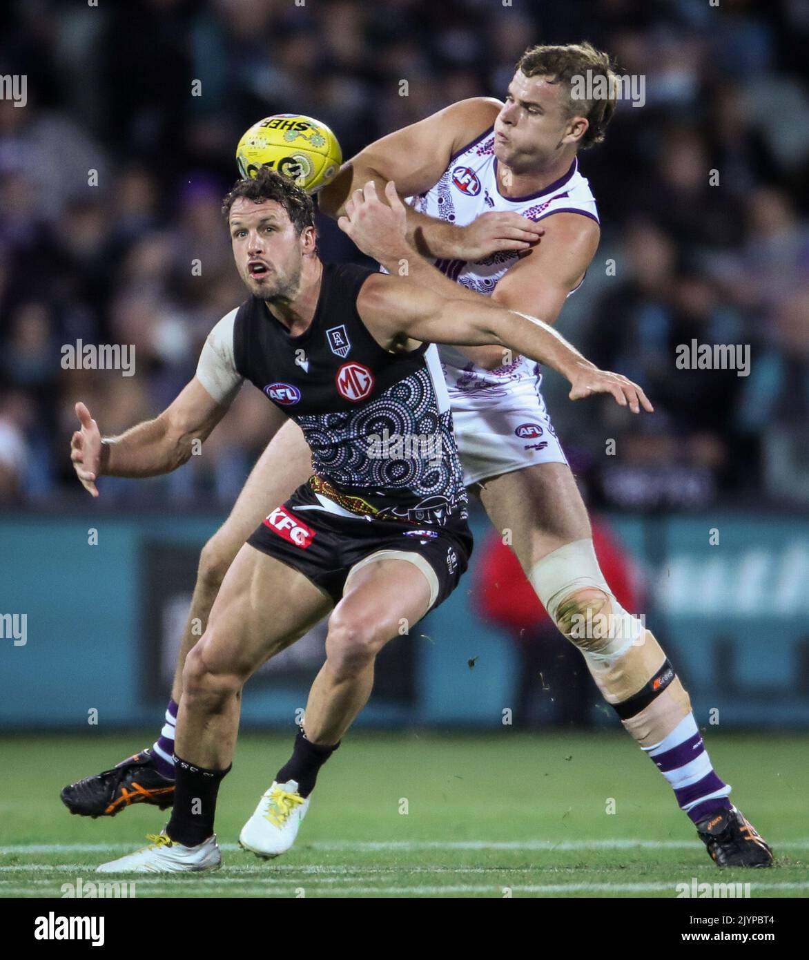 Travis Boak of the Power clashes with Sean Darcy of the Dockers during ...