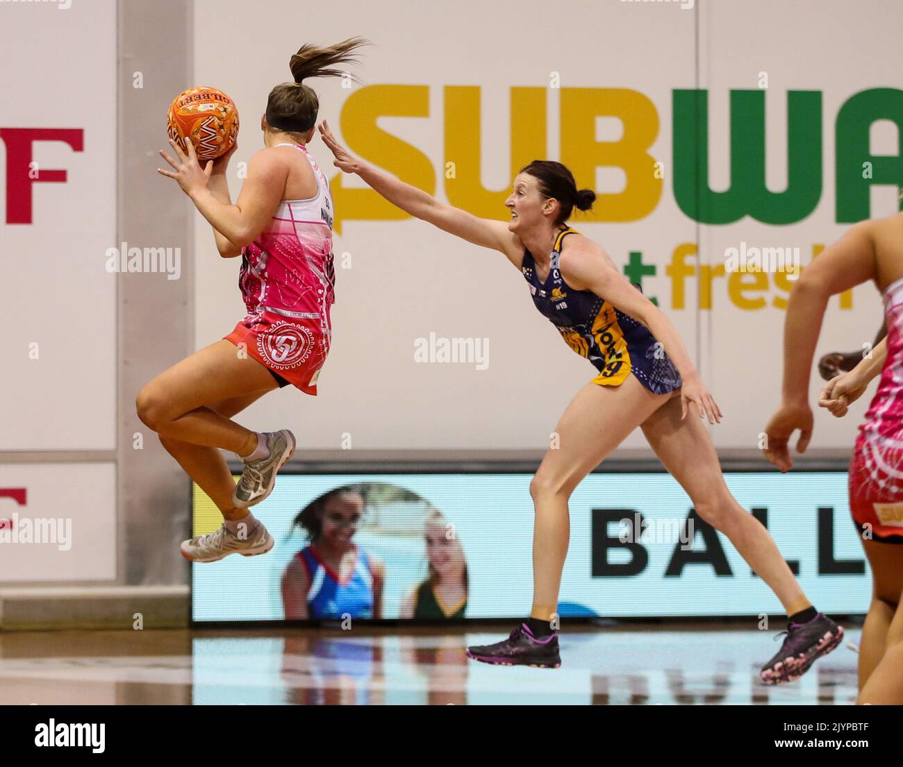 Maisie Nankivell of the Thunderbirds under pressure from Kate Shimmin ...