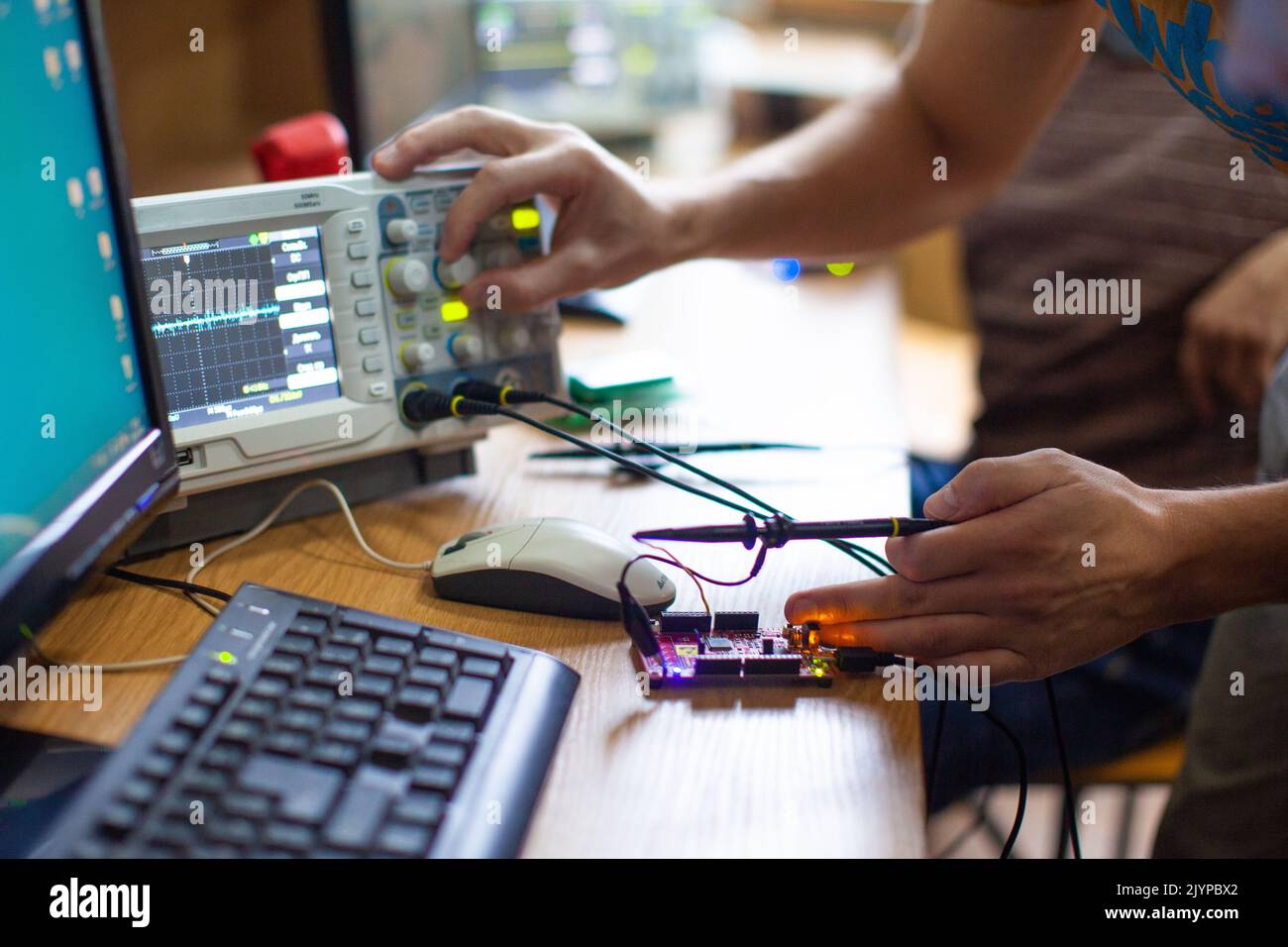 engineers work with electrical measuring devices Stock Photo - Alamy