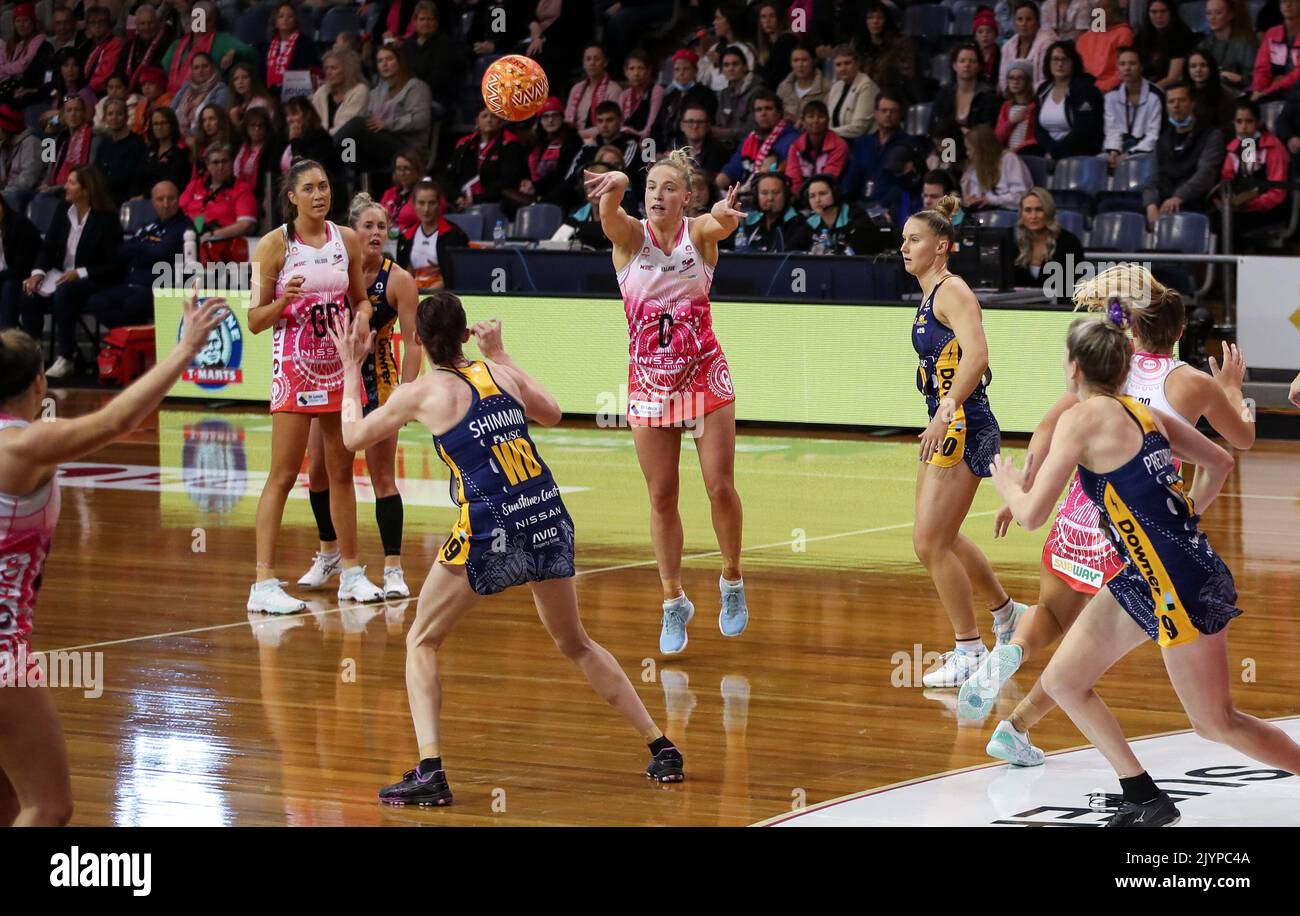 Hannah Petty of the Thunderbirds passes the ball over Kate Shimmin of ...