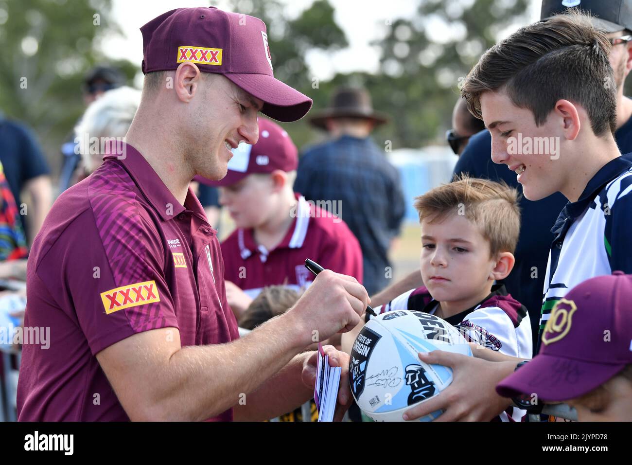 Daly Cherry-Evans (left) is seen with fans during the Queensland ...