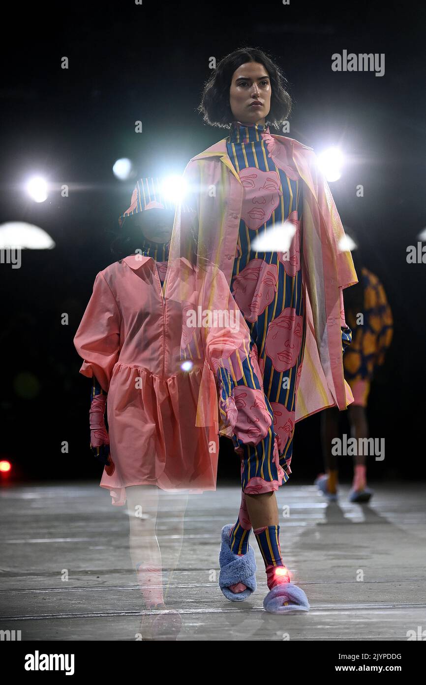 An in-camera multiple exposure of models walking the runway during the ...