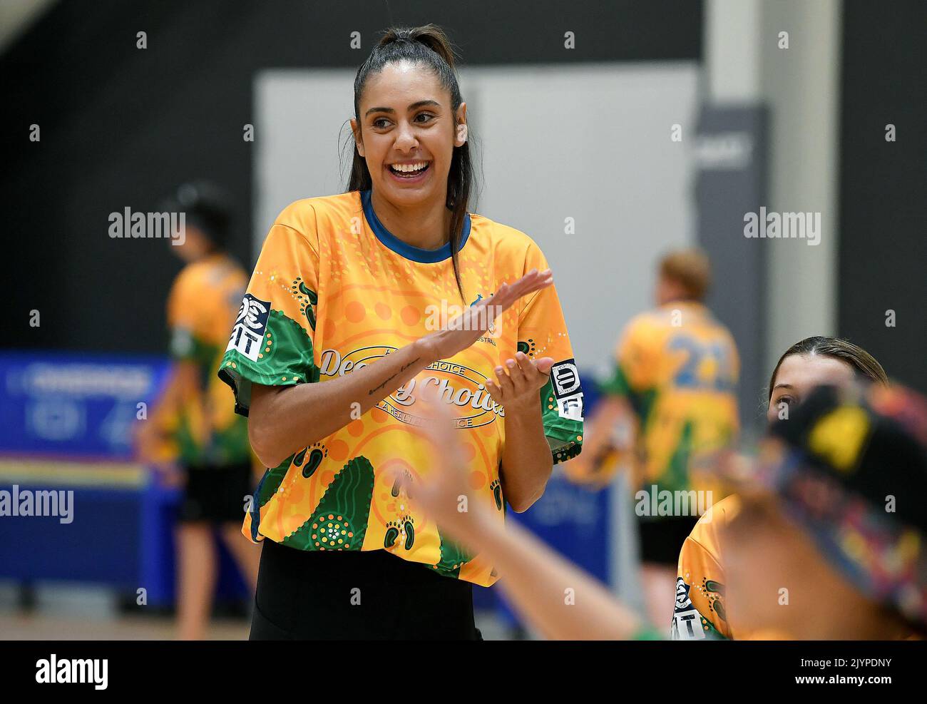 Australian beach volleyballer Taliqua Clancy reacts with students ...