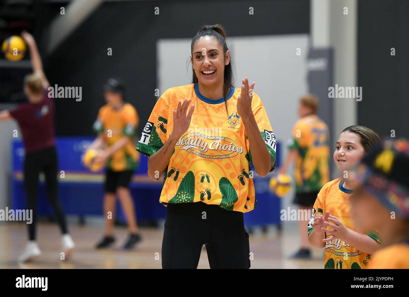 Australian beach volleyballer Taliqua Clancy is seen with students ...