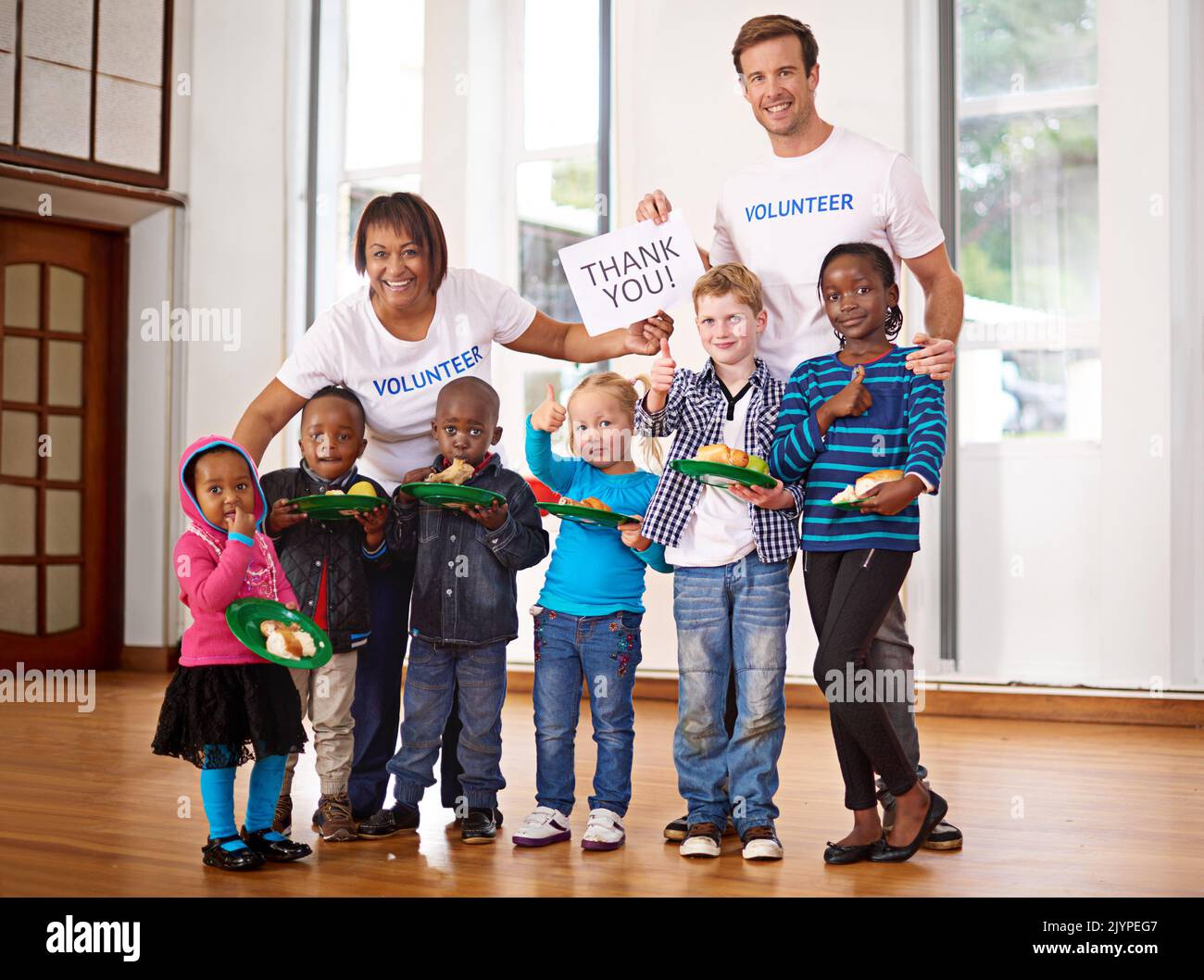 Every child deserves a healthy meal. Portrait of a volunteer holding up ...