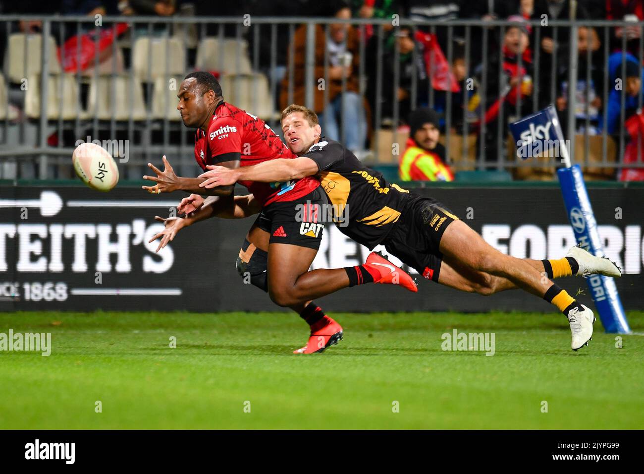 Manasa Mataele of the Crusaders scores a try in the tackle of Kyle ...