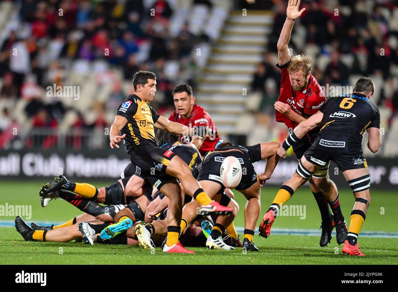 Tomas Cubelli of the Force kicks under pressure from Mitchell Dunshea ...