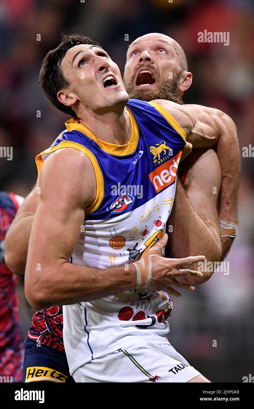 Oscar McInerney of the Lions contests for the ball with Max Gawn of the ...
